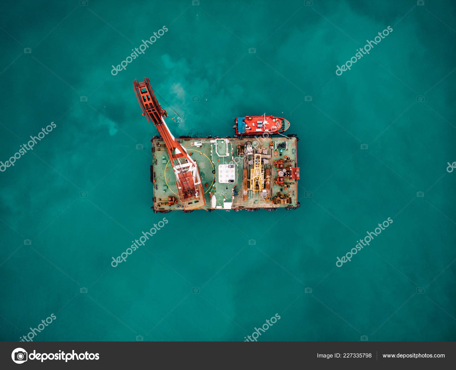 Offshore industrial platform or tower with crane or science sea ...