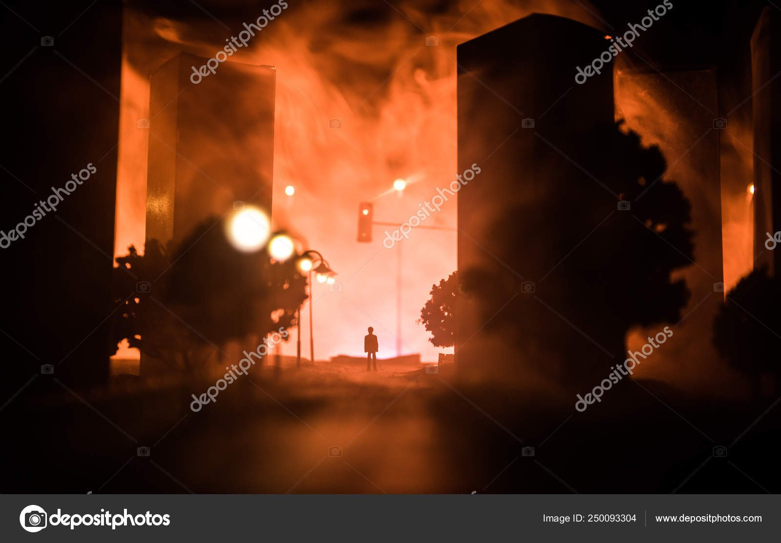 Artwork decoration. A man standing on a road of burnt up city ...