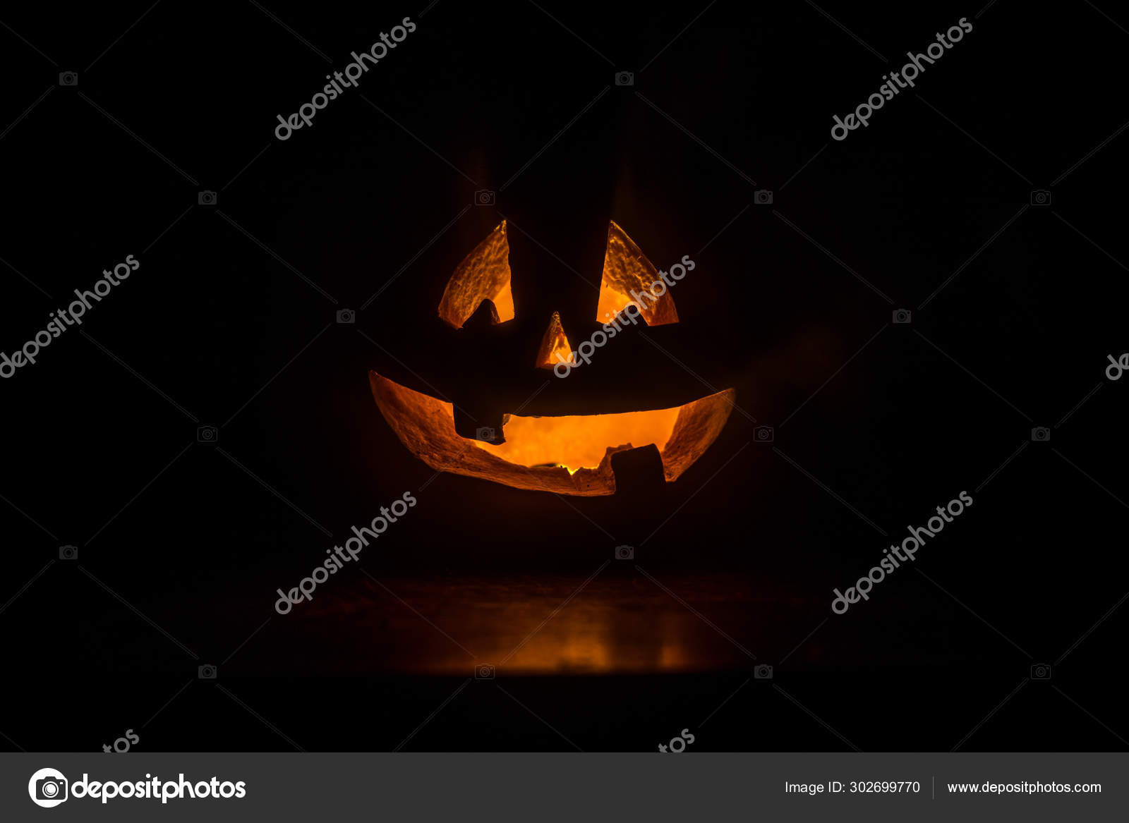 Halloween pumpkin smile and scrary eyes for party night. Close up view ...