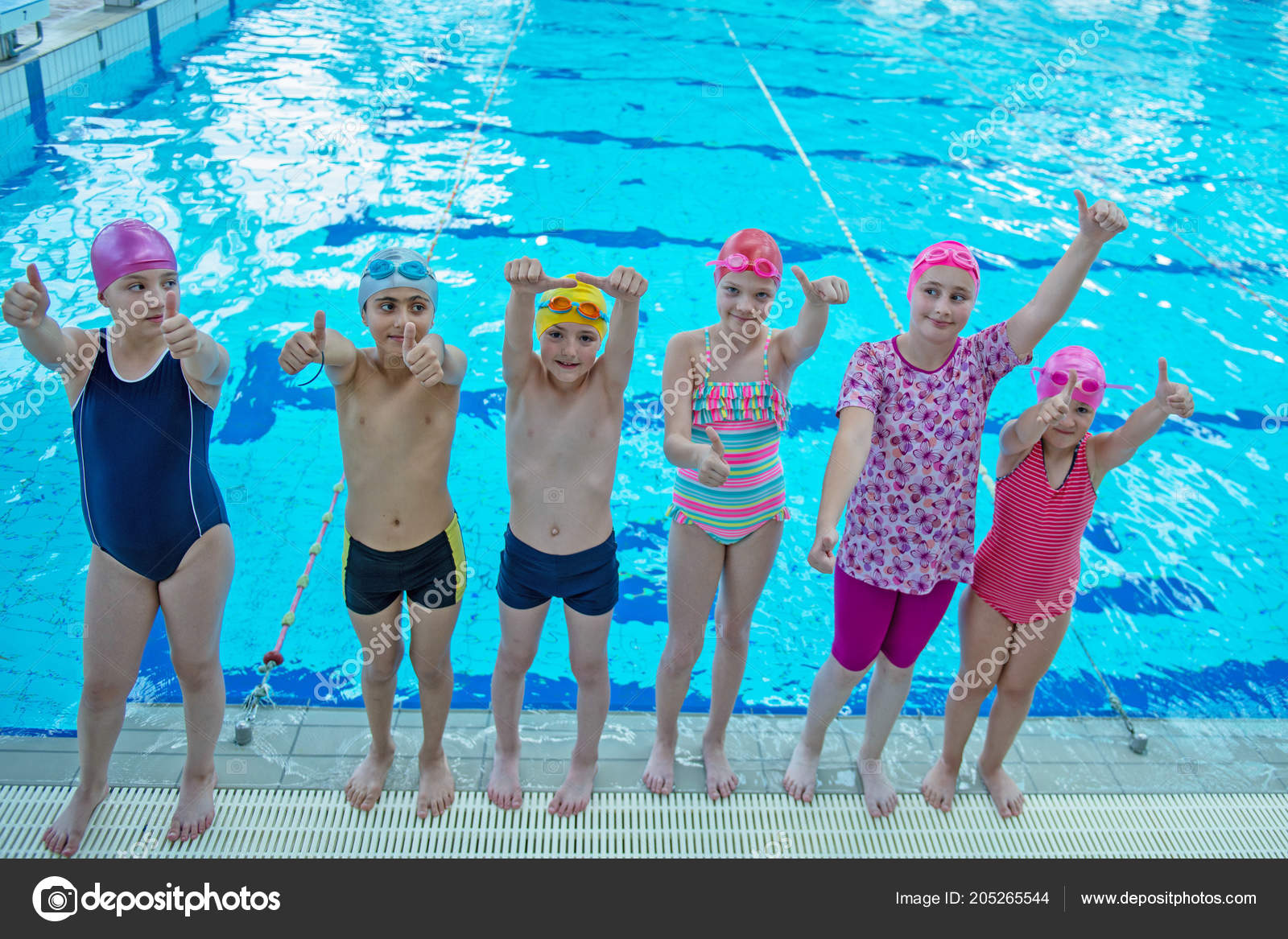 Happy children kids group at swimming pool class learning to swim Stock Photo by ©FS-Stock 205265544