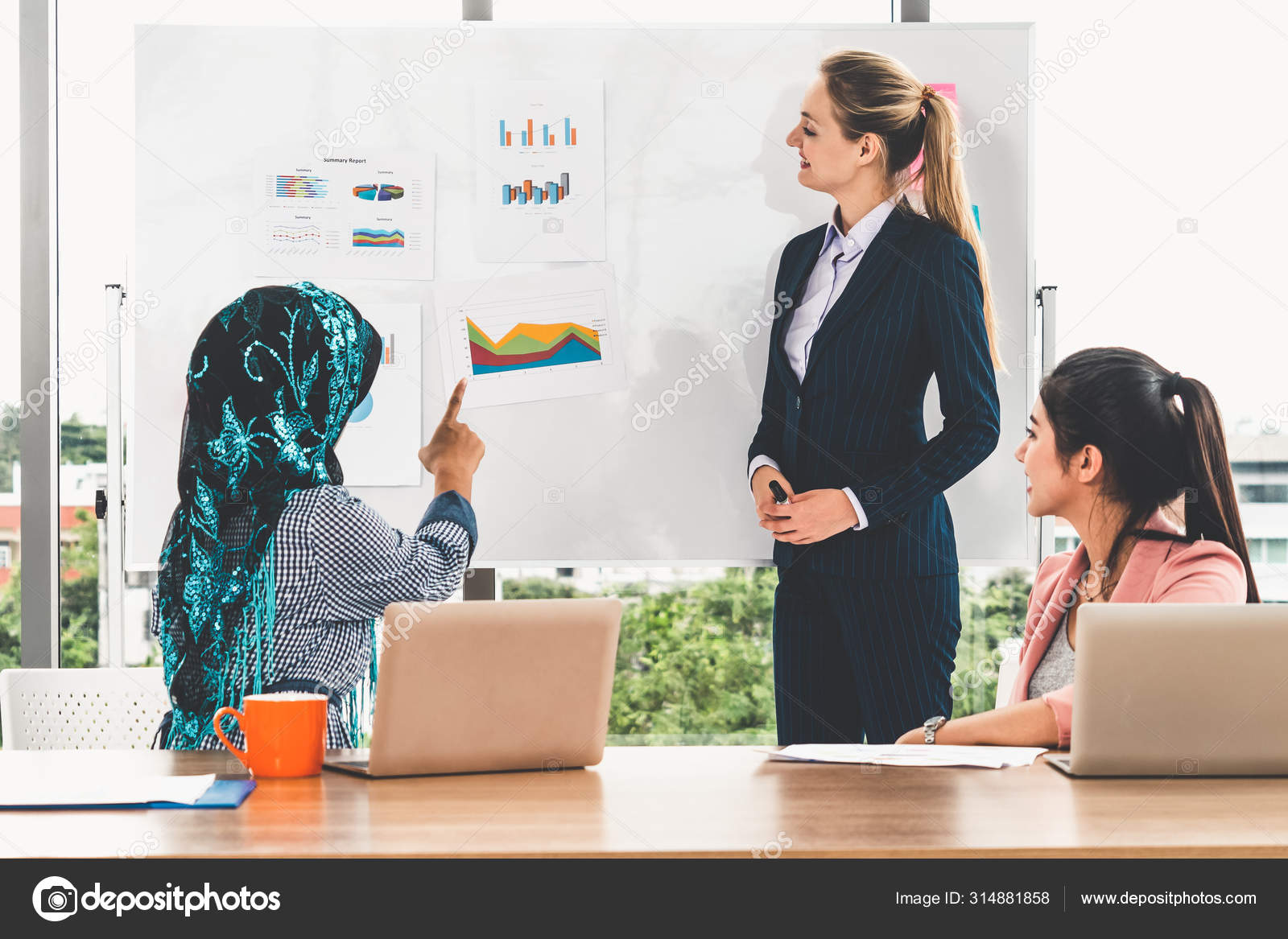 Multicultural working group in teamwork meeting. Stock Photo by ...