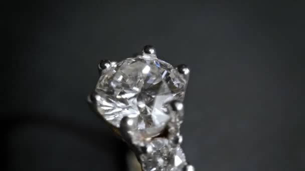 Extreme detailed of diamond ring close up shot while rotating on dark ...
