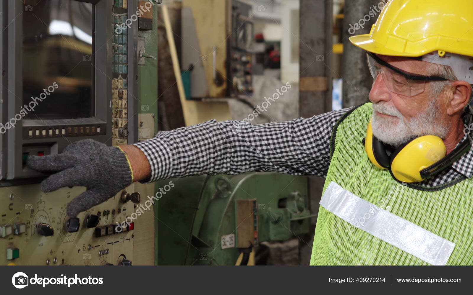 Smart factory worker using machine in factory workshop Stock Photo by ...