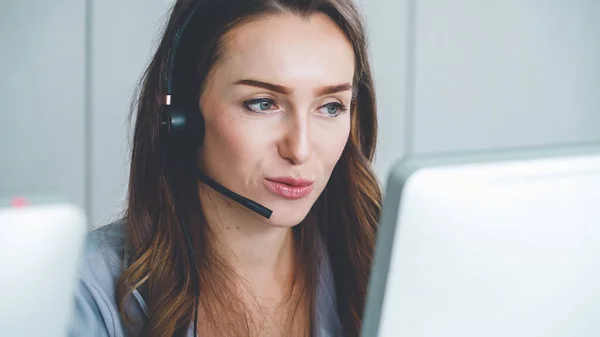Business people wearing headset working in office - Stock Image ...